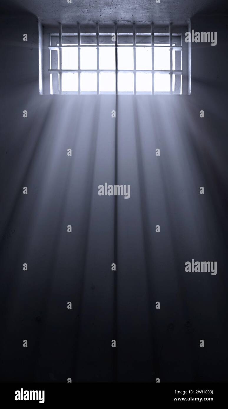 Sun rays in dark prison cell Stock Photo - Alamy
