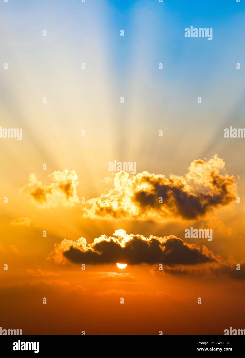 Blue sky with cirrus clouds and bright sunrise. Vertical photo Stock ...