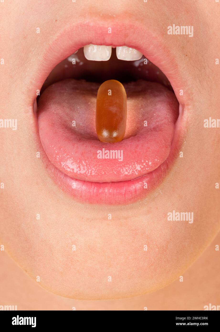 Swallowing the tablet Stock Photo - Alamy