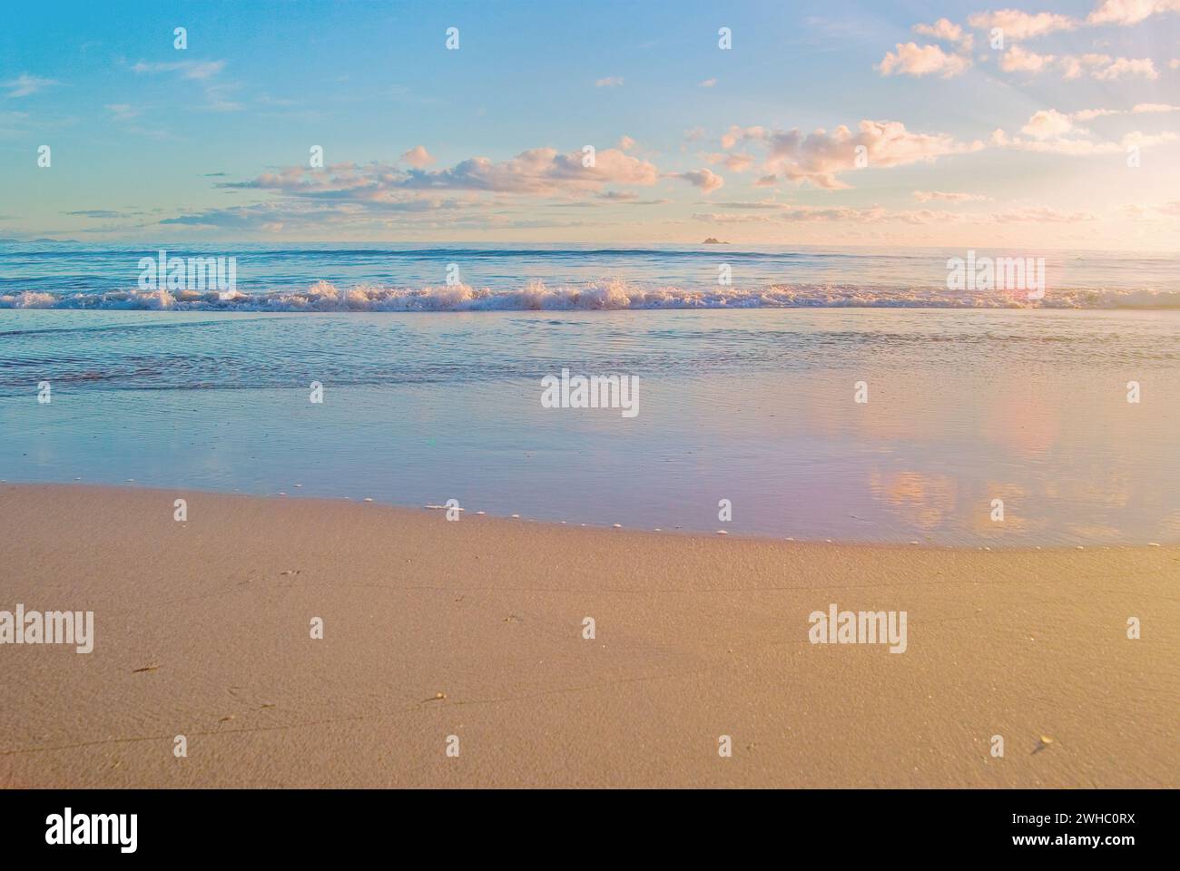 Beach sunrise scene Stock Photo - Alamy