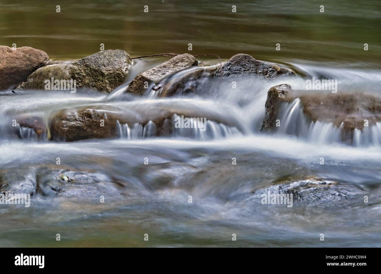 Stream water on rocks in hi-res stock photography and images - Alamy
