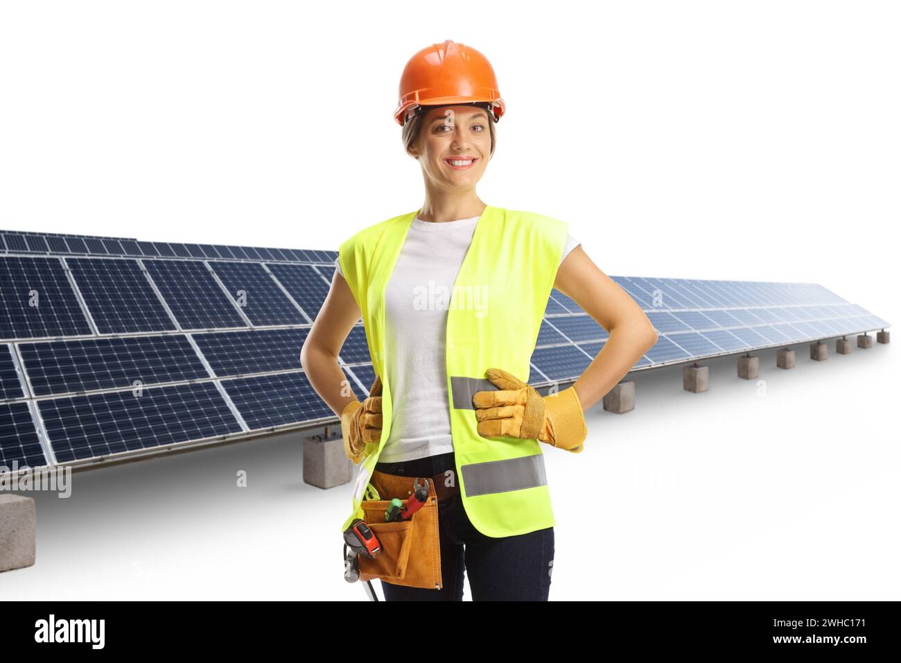 Solar farm and a female construction worker wearing a helmet and a tool ...
