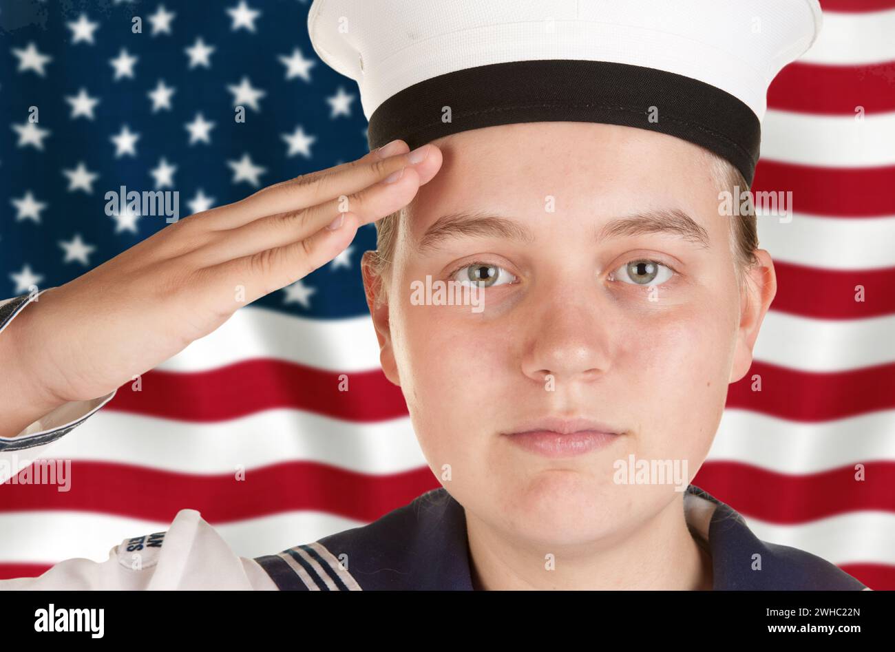 Young sailor saluting in front of US flag Stock Photo - Alamy
