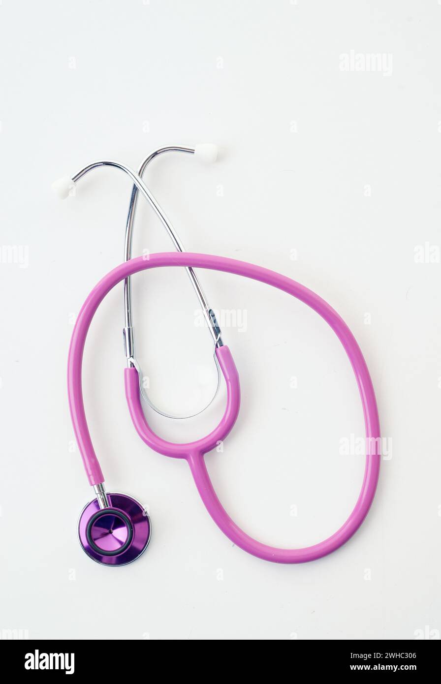 Pink stethoscope on white Stock Photo - Alamy