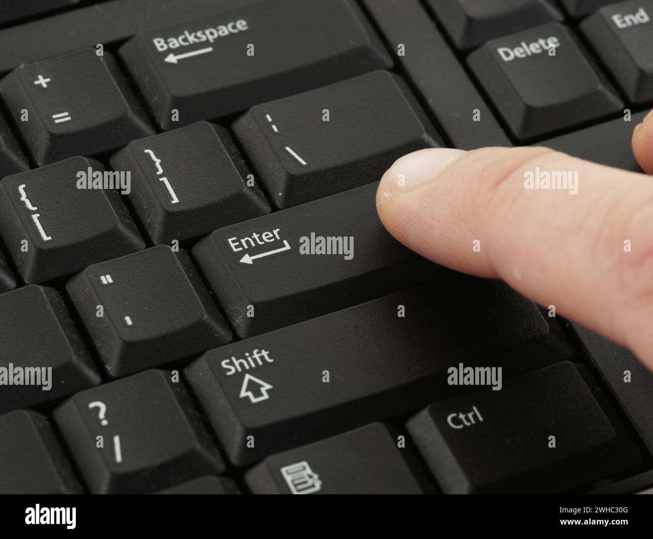 Finger pressing keyboard Stock Photo - Alamy