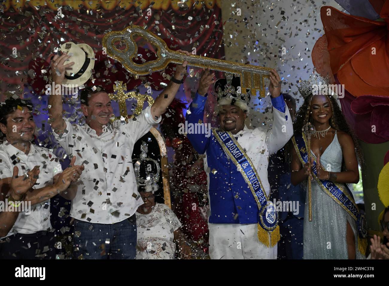 Carnival King Momo, Caio Cesar Dutra, center right, receives the keys ...