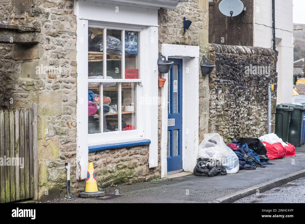 Overflowing laundry on the pavement outside Cragdale launderette in ...