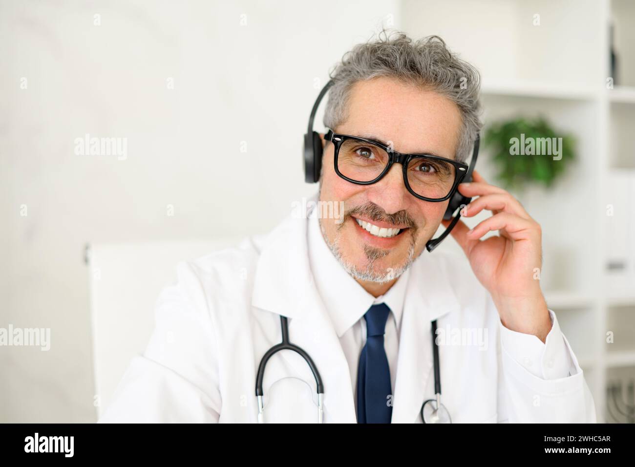 The doctor is shown in a telehealth setting, cheerfully engaging with a ...