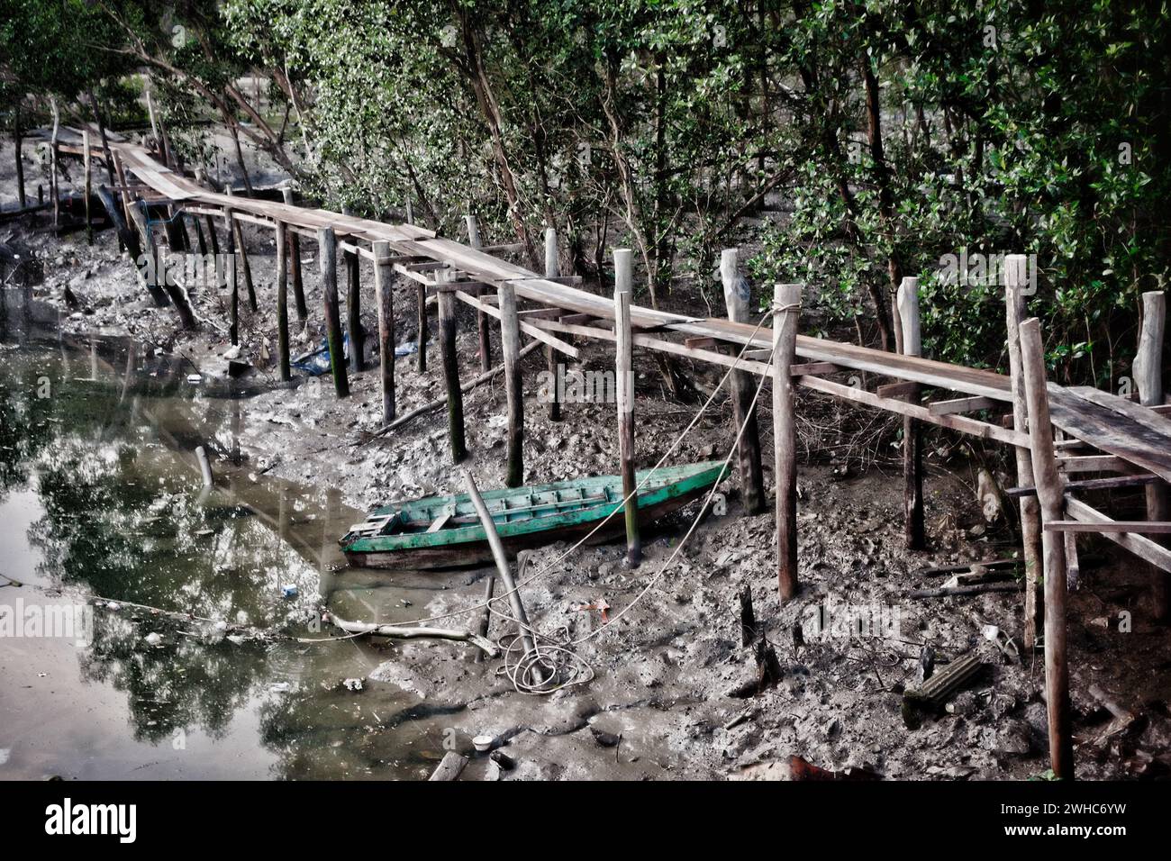 Old row boat in mud Stock Photo - Alamy