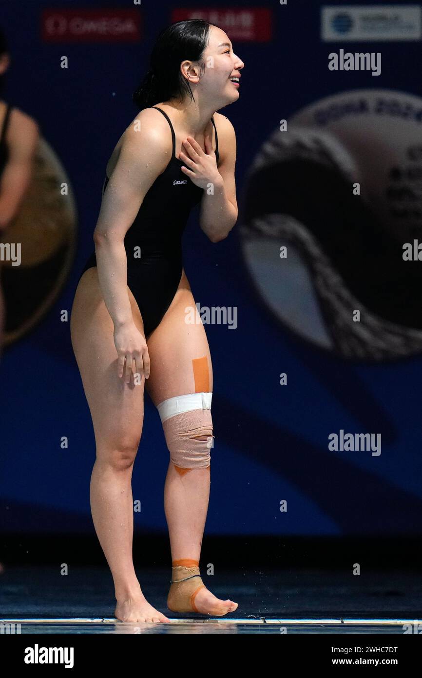 Kim Suji of South Korea reacts as she sees the scoreboard during the women's 3m springboard ...