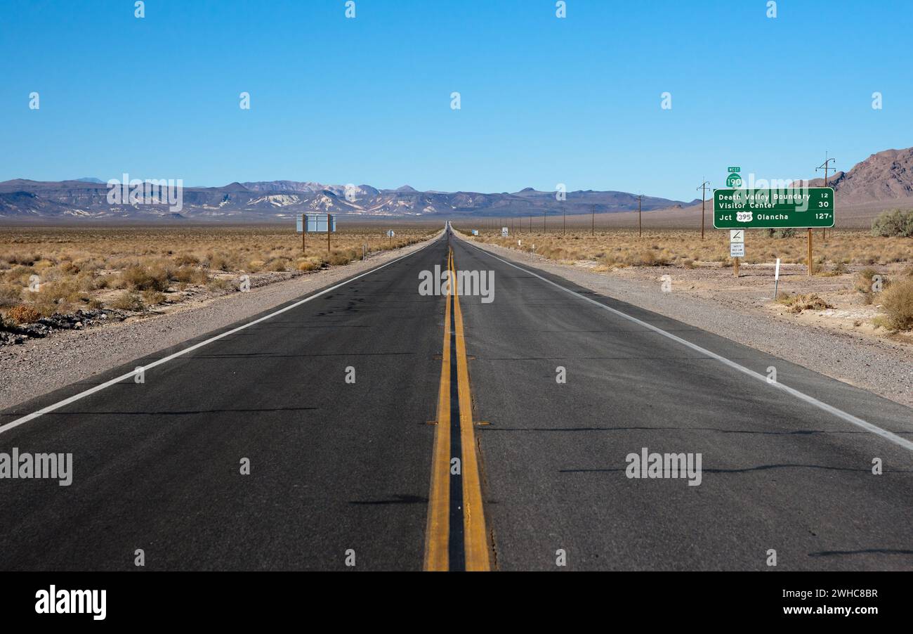 Long highway through desert Stock Photo - Alamy