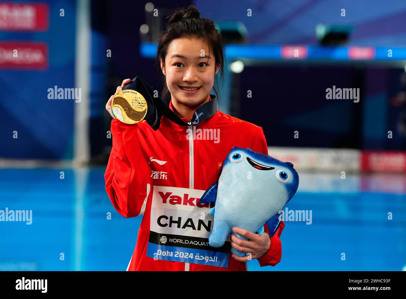 Chang Yani of China holds up her gold medal after winning the women's ...
