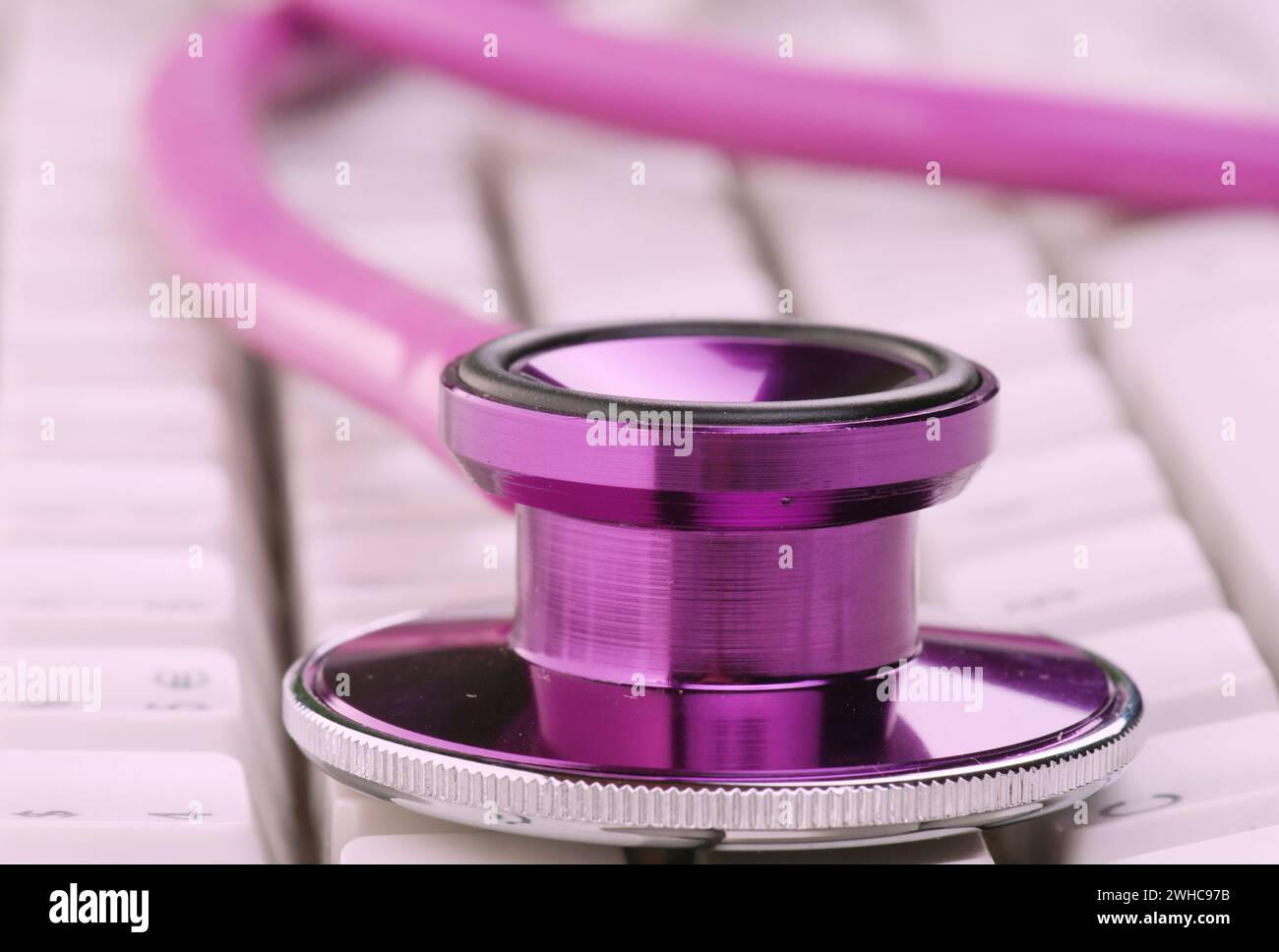 Pink stethoscope on keyboard Stock Photo - Alamy