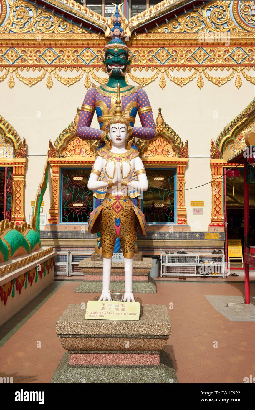 Statues outside temple Stock Photo - Alamy