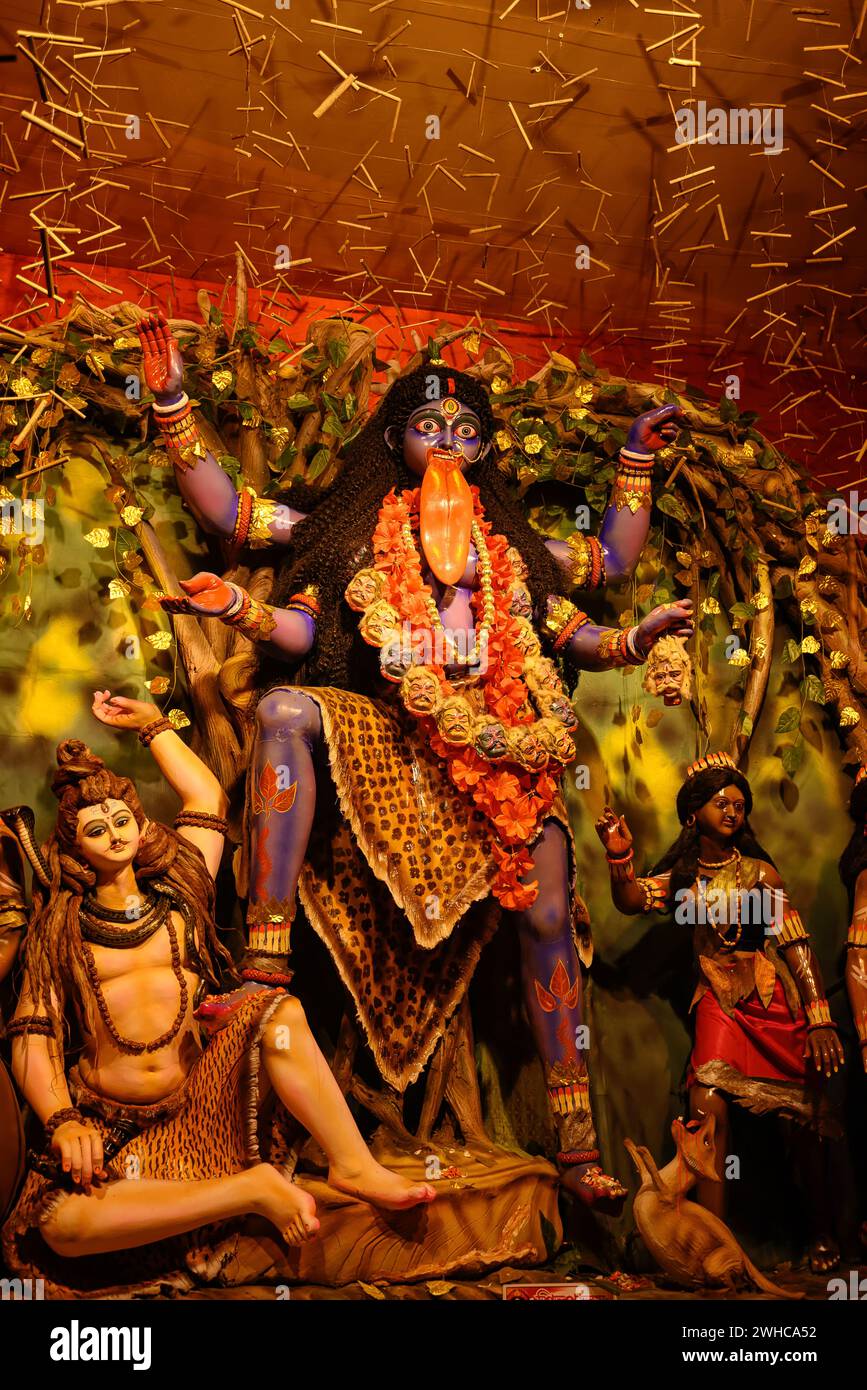 Idol of Goddess Maa Kali at a decorated puja pandal in Kolkata, West Bengal, India. Kali puja ...