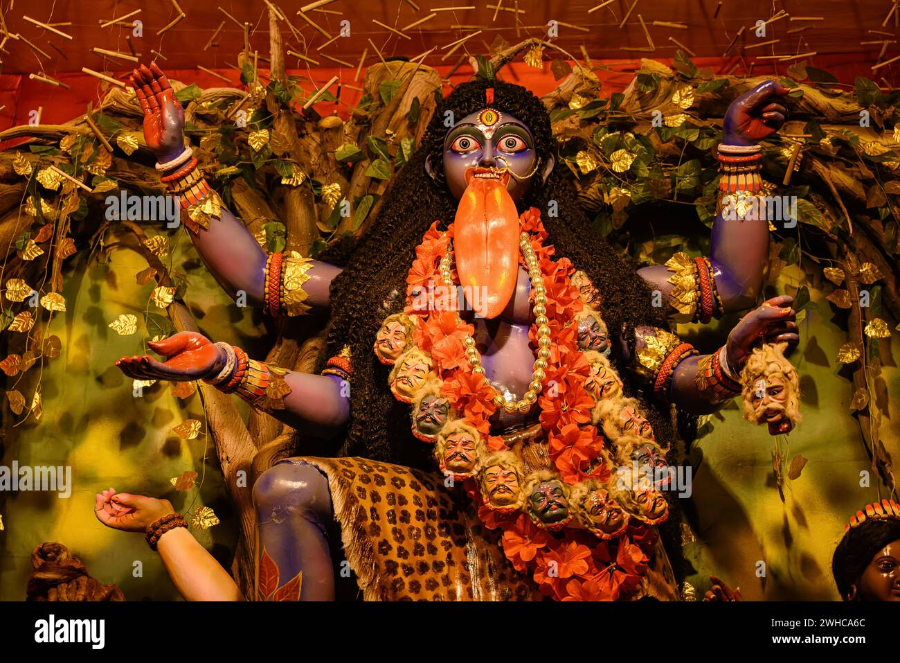 Idol of Goddess Maa Kali at a decorated puja pandal in Kolkata, West Bengal, India. Kali puja ...