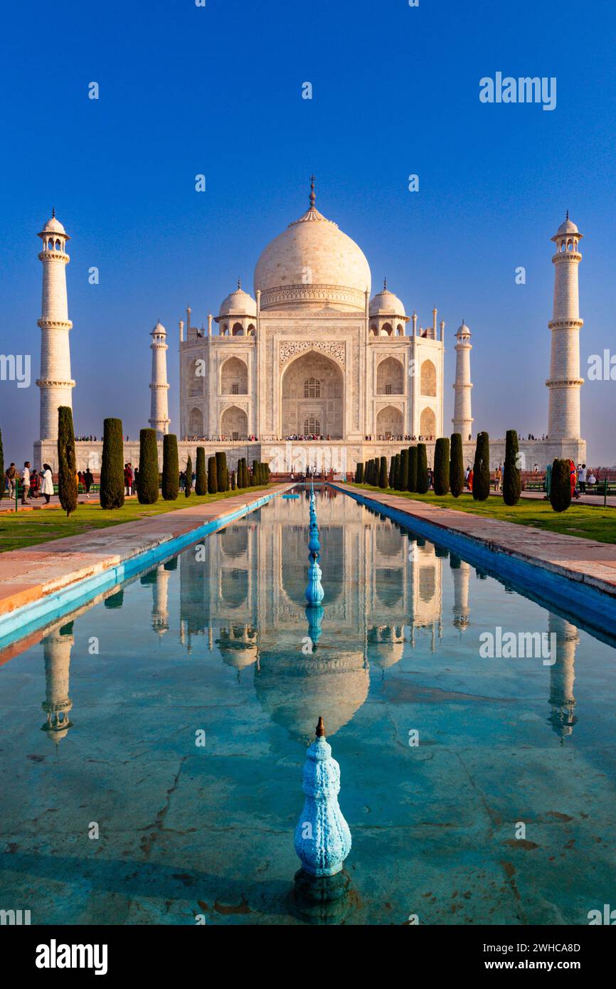 Symmetrical view of the Taj Mahal with its reflection in the water ...