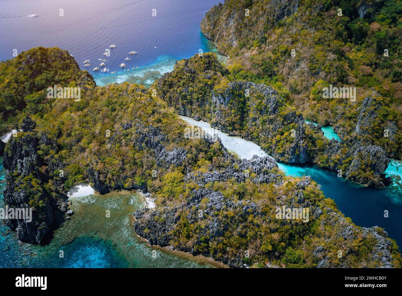 Aerial drone of entrance to big lagoon with limestone cliffs and blue ...