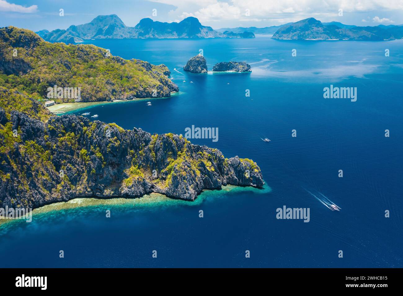 Aerial drone view of a tropical Mantiloc island coastline and open ...