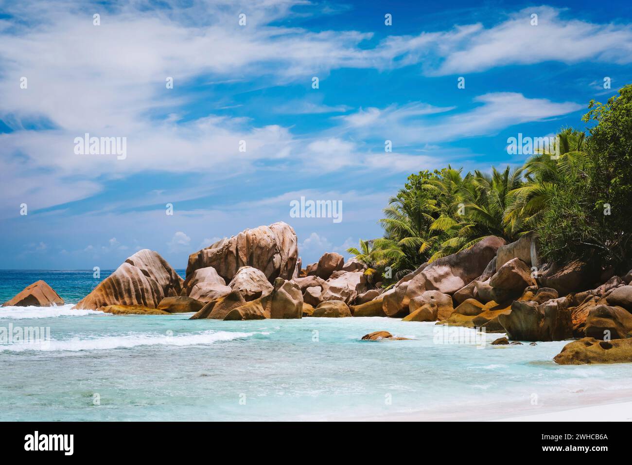 Beautifully shaped granite boulders, shallow tropical lagoon at ...