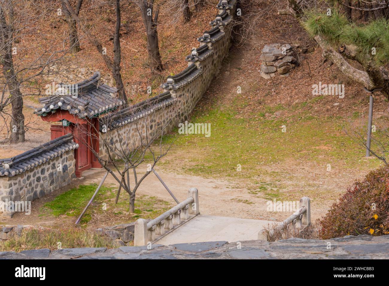 Landscape of public park with oriental stone wall and and gate with ...