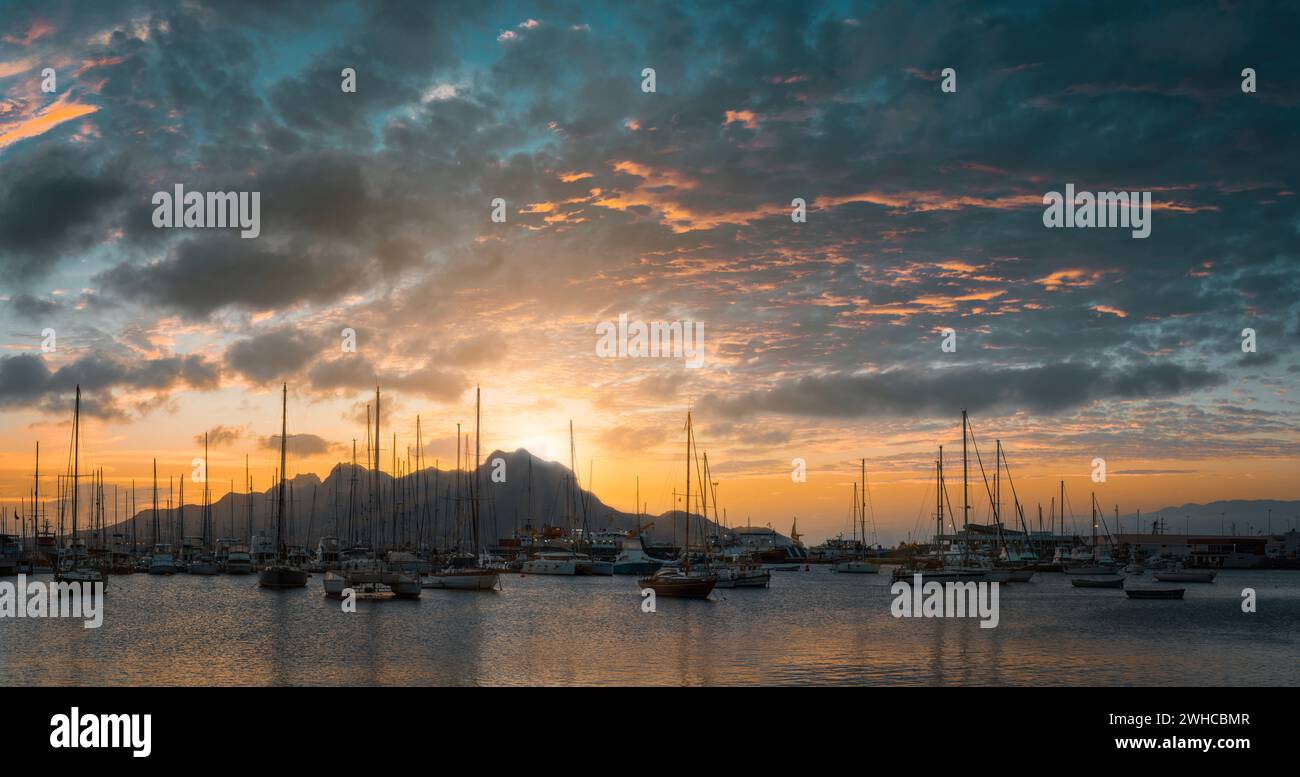 Beautiful sunset over Monte Cara mountain in hardor of Mindelo. Sao ...