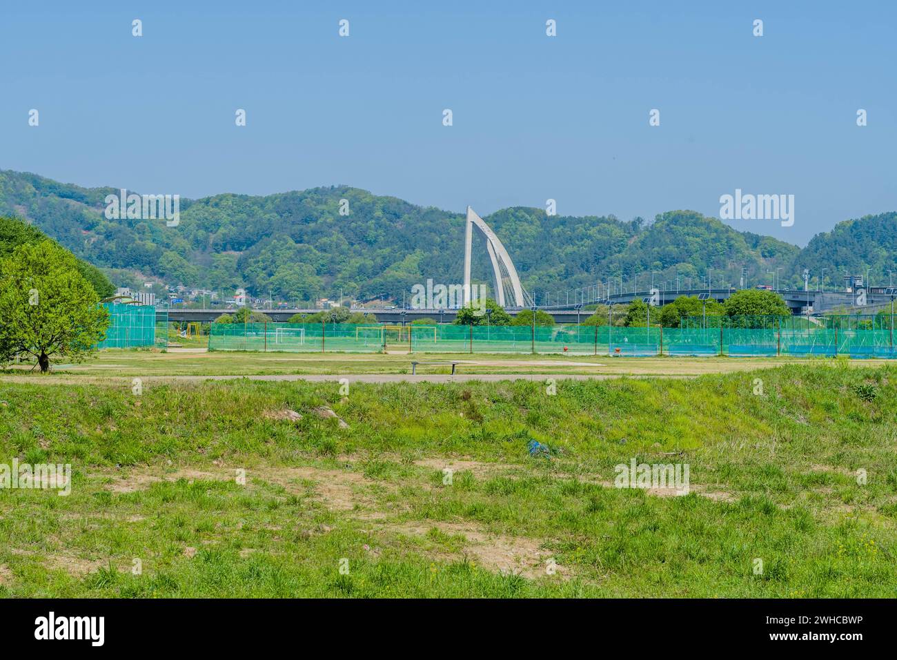 Landscape of rural park with bridge arch in background Stock Photo - Alamy