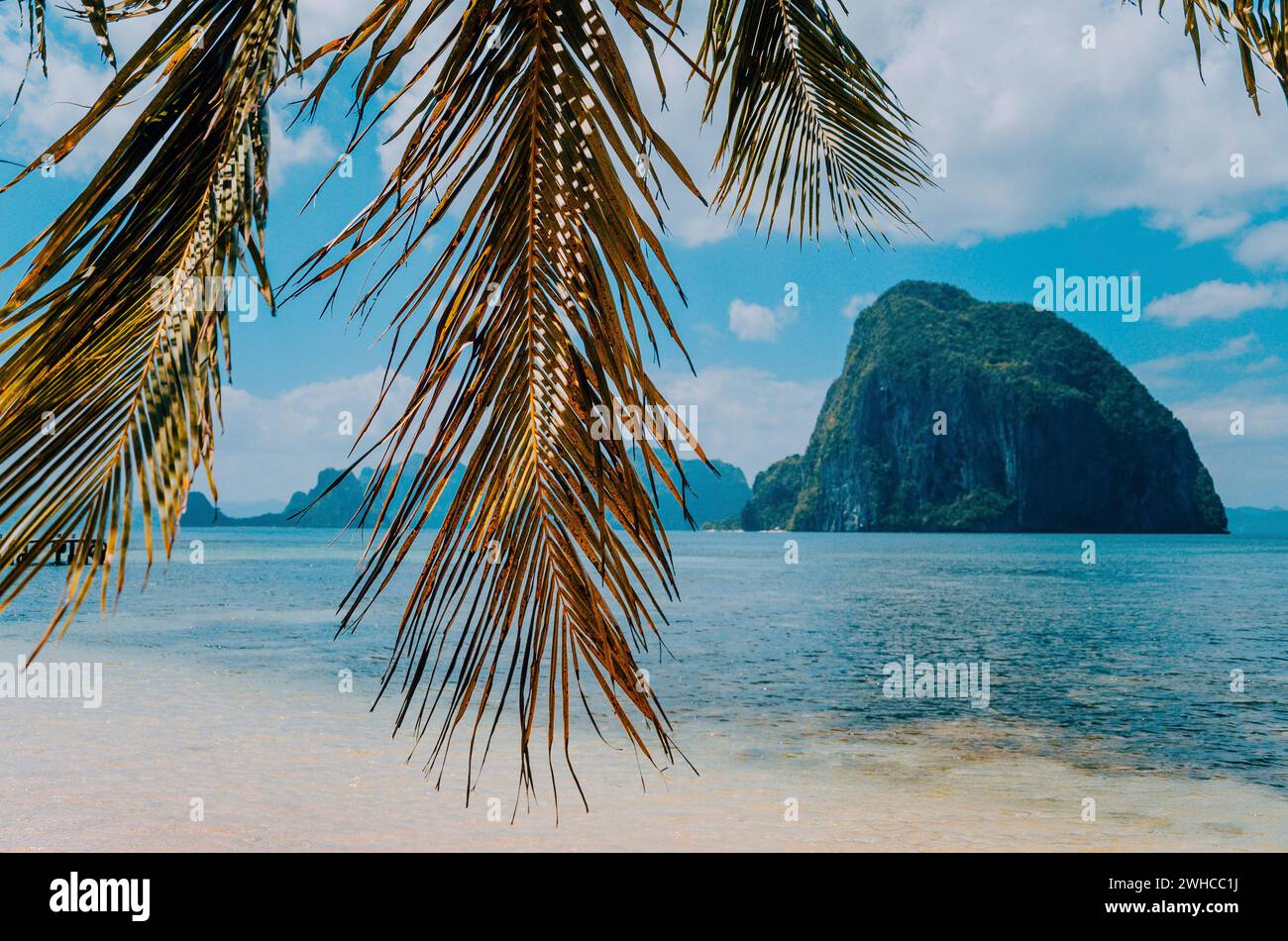 Huge Rock of Pinagbuyutan Island in blue ocean. Landscape of El Nido ...