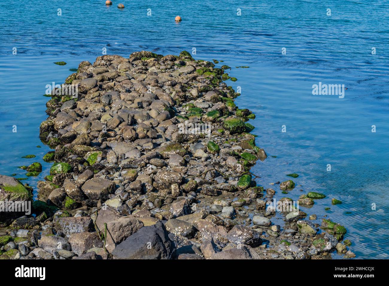 Peninsula of rocks jutting out into blue ocean water in Yeosu, South ...