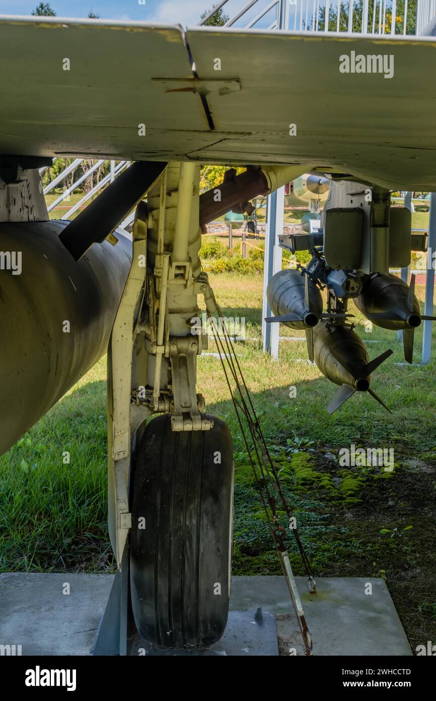 Rear view of landing gear and battery of missiles mounted under wing of ...