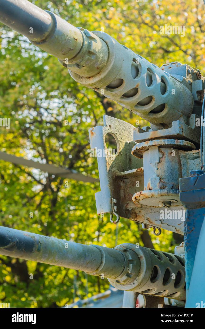 Cooling jackets of two machine guns mounted on a turret on display in ...