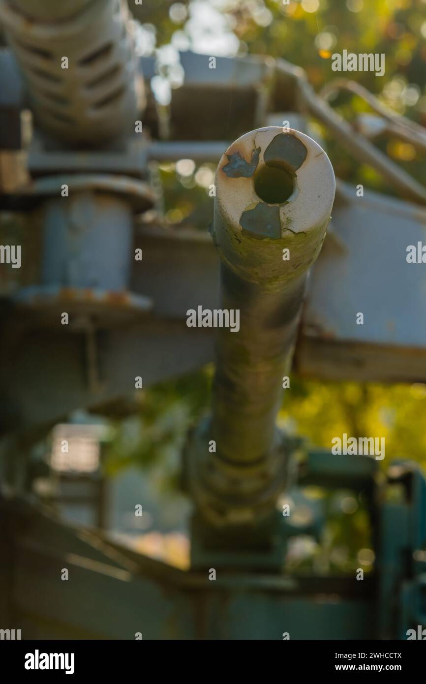 Closeup of machine gun muzzle with barrel, turret and mount blurred out ...
