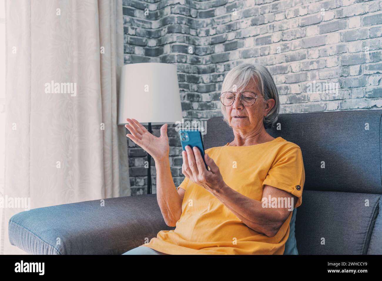 Upset woman using calculator hi-res stock photography and images - Alamy