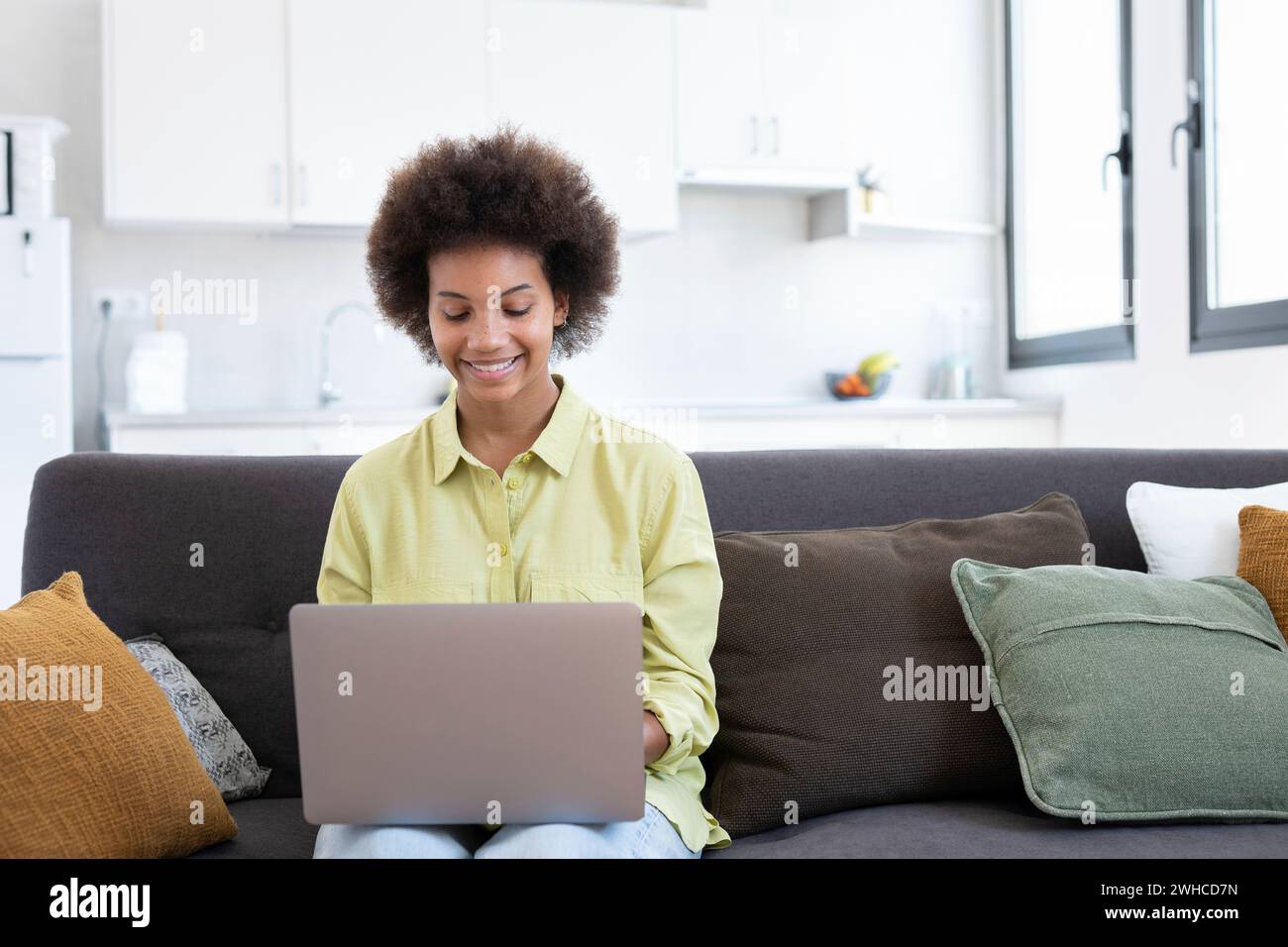 Young african woman browsing internet hi-res stock photography and ...