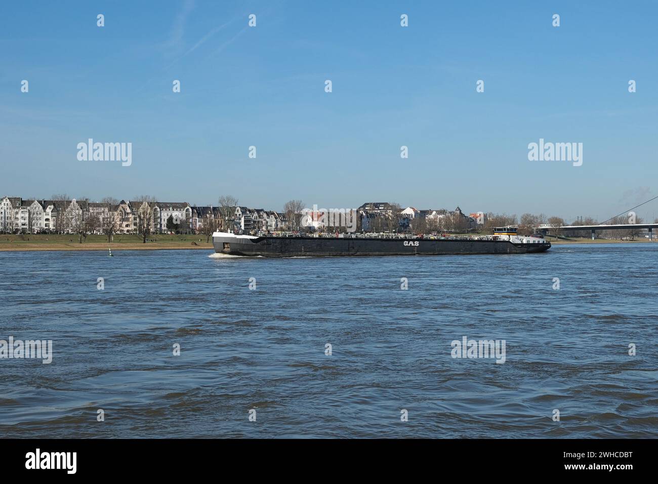 View over the Rhine with cargo ship, behind Oberkassel, Duesseldorf ...
