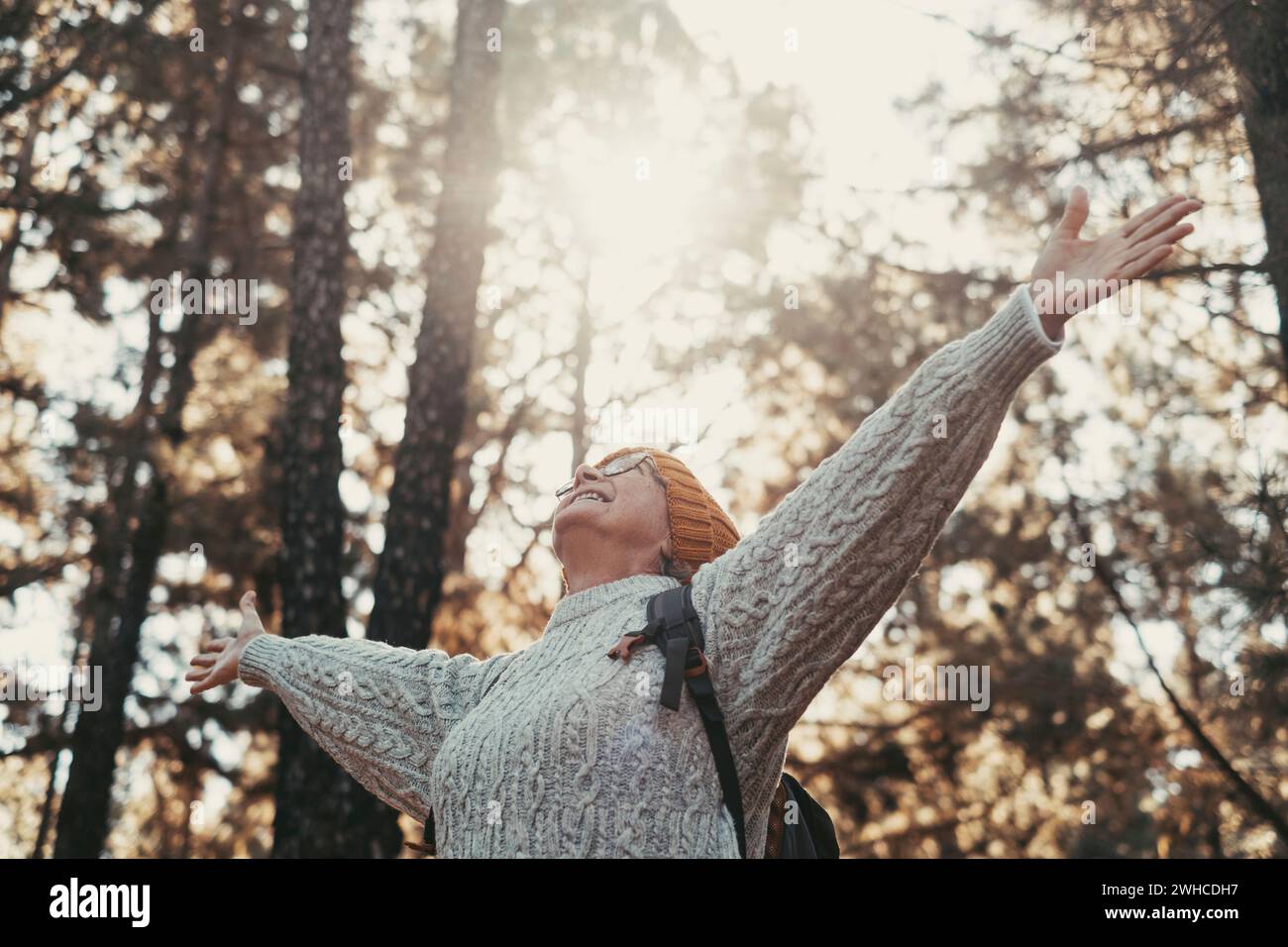 Portrait, close up of one middle age woman looking at the trees ...