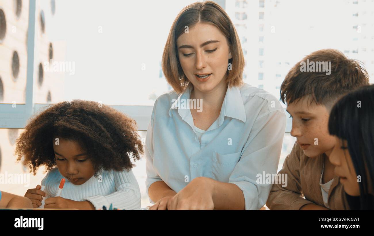 Professional caucasian teacher telling story to diverse student while ...