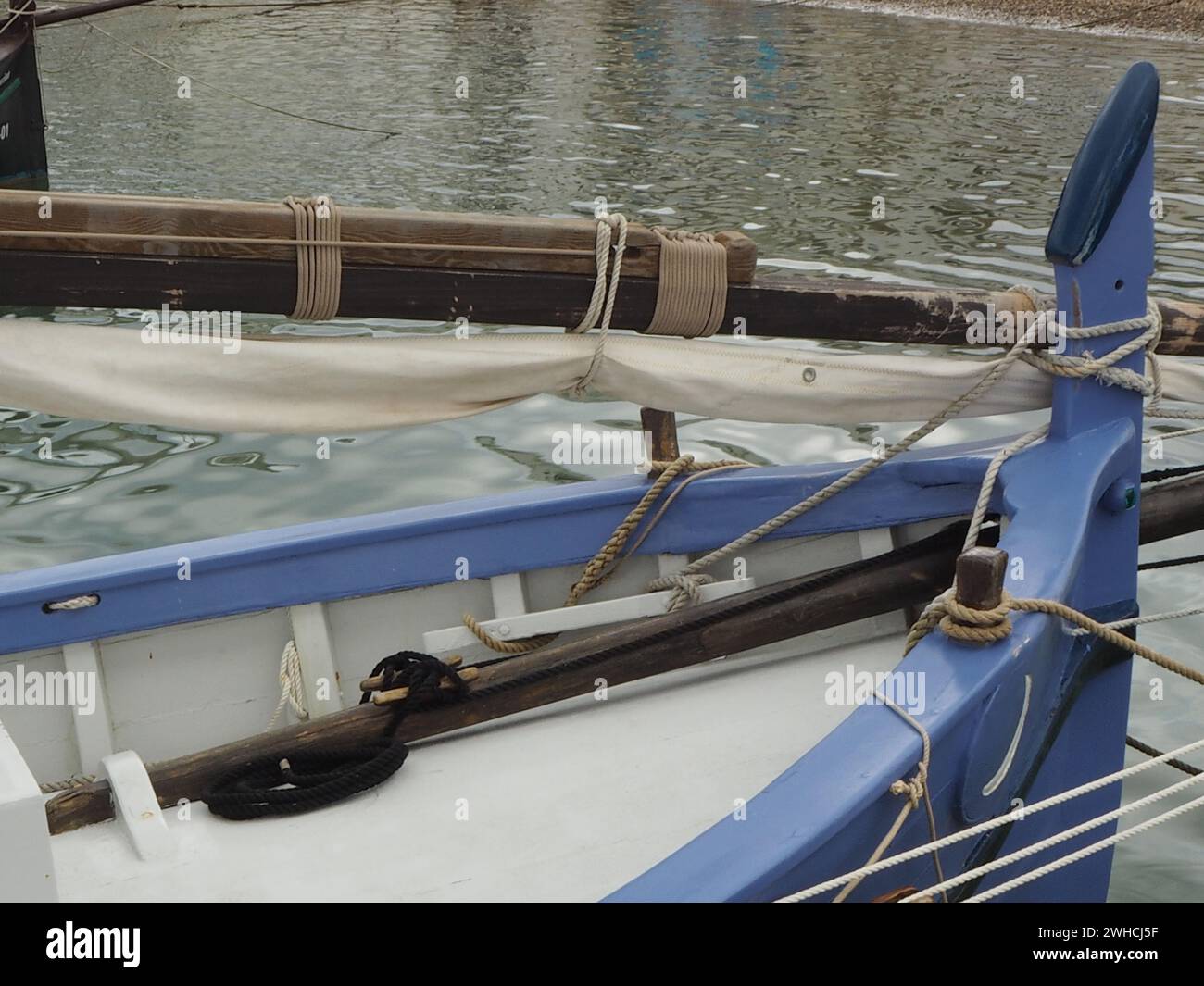 Boat rigging and masts of fishing boats anchored in a port located on ...