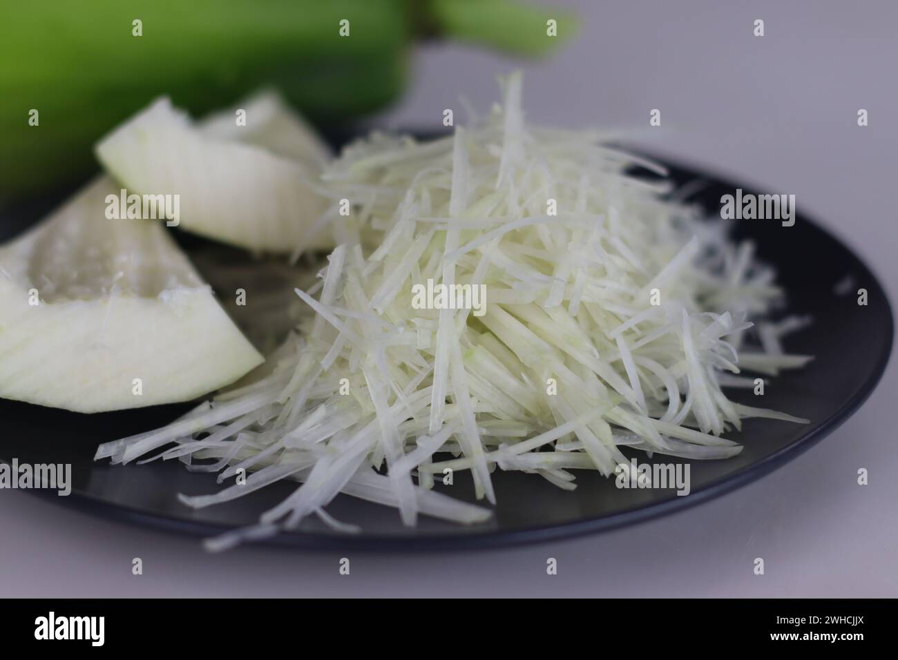 Fresh raw green papaya and shredded papaya on display, perfect for ...