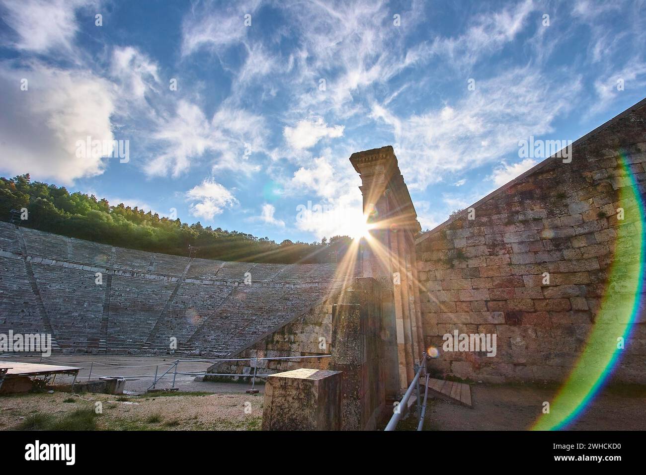 The sun shines through an ancient ruin in the amphitheatre and creates ...