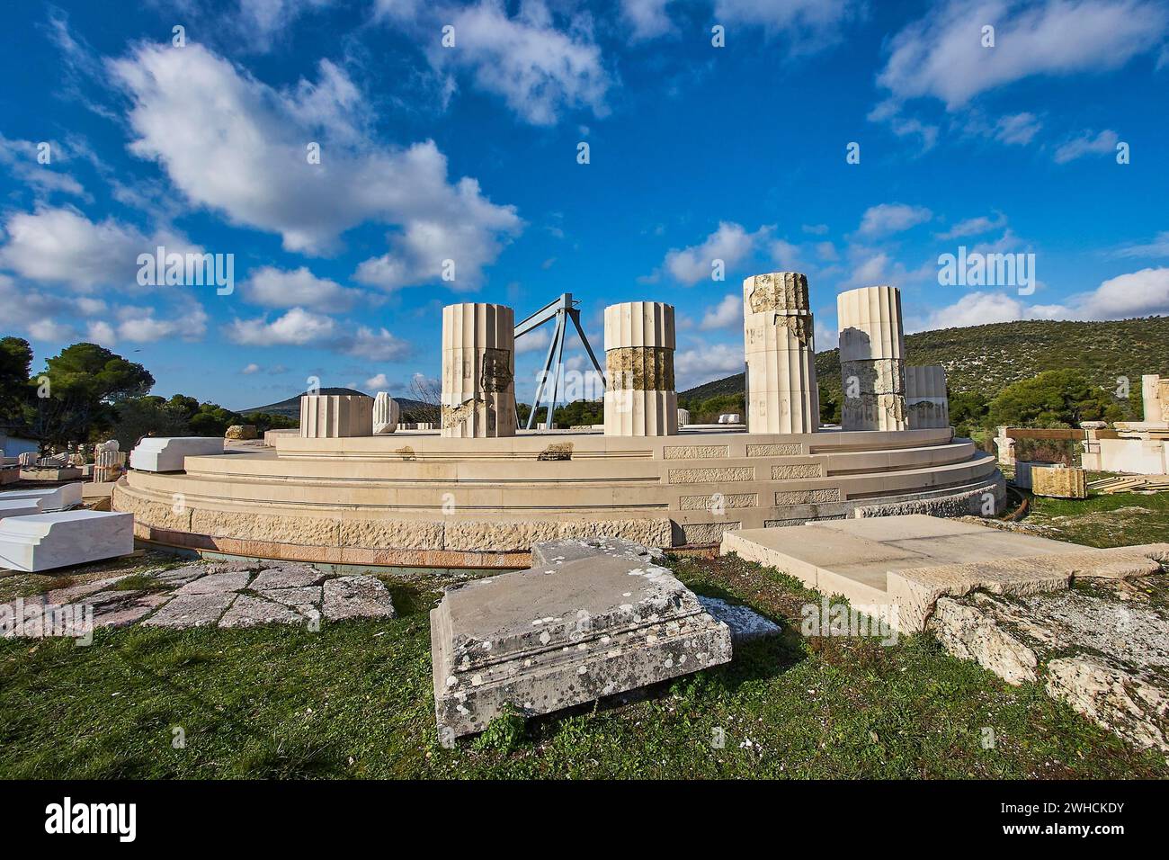Round ruins with columns under a cloudy sky, Ancient Temple, Epidaurus ...