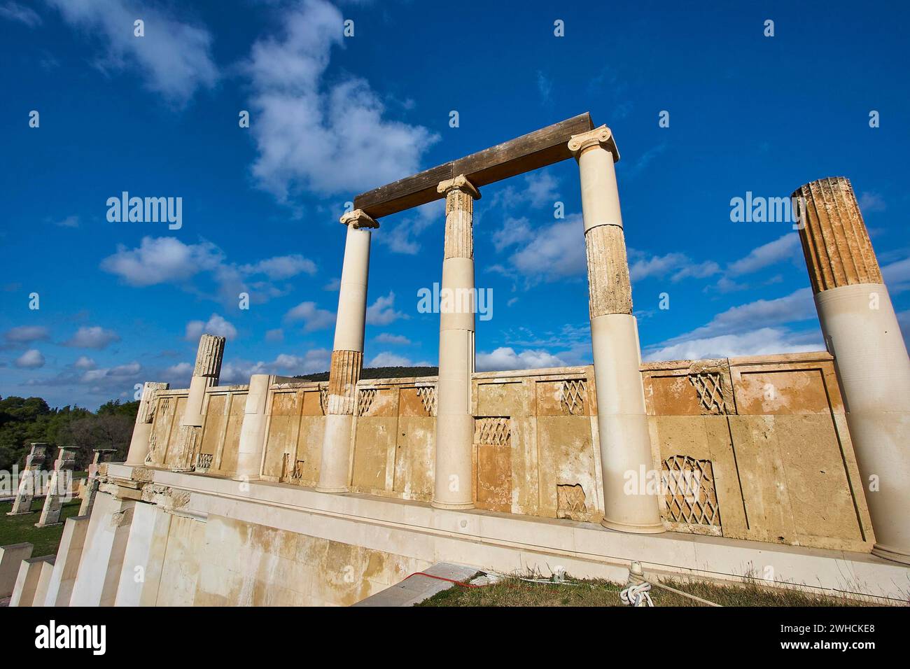 Columns of an ancient temple rise against a blue sky, Ancient Temple ...