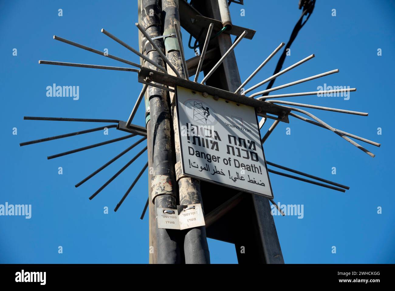 Warning sign on electricity pylon, Florentine neighbourhood, Tel Aviv ...