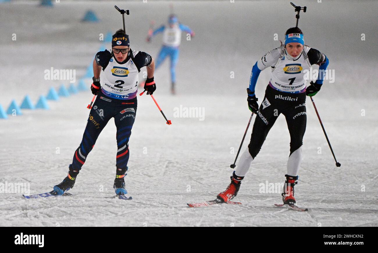 Julia Simon of France, left, and Tuuli Tomingas of Estonia compete in ...