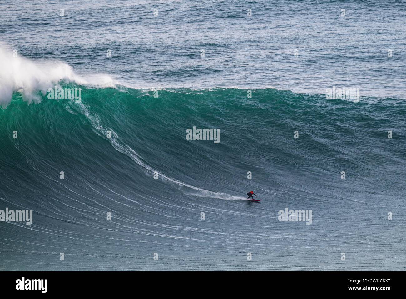 Nazare portugal big wave surfer hi-res stock photography and images - Alamy