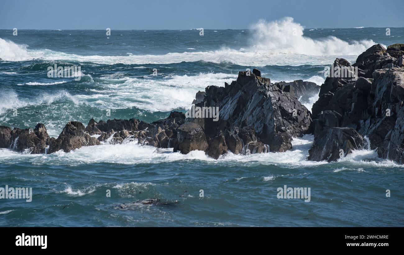 A photo of rocks in rough waters of the Pacific Ocean off the Alaskan coast Stock Photo - Alamy