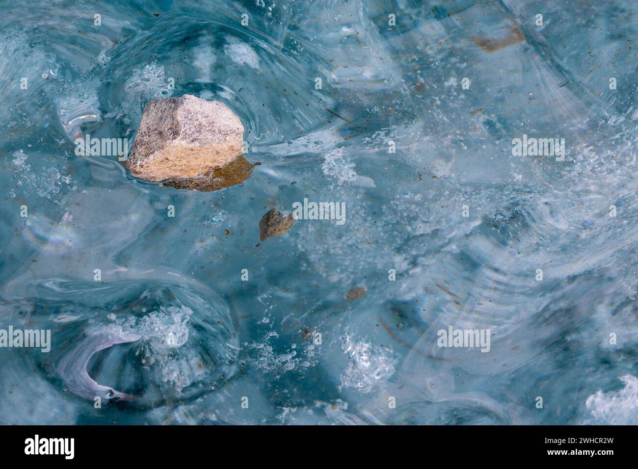 Trapped stone in an ice structure, glacier cave, winter, Morteratsch ...