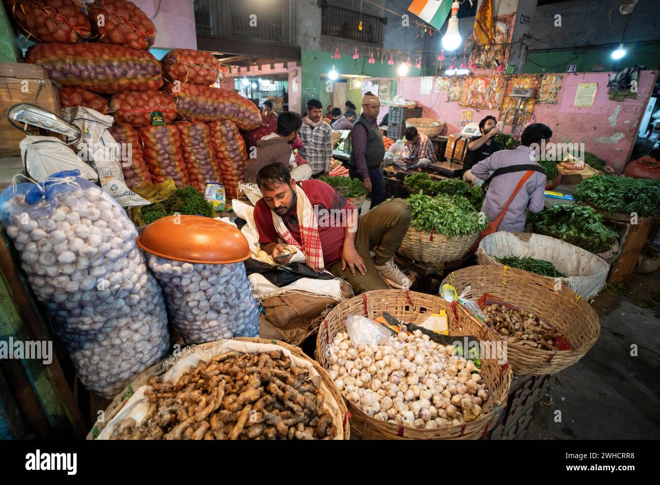 Vendor selling vegetables at a market, ahead of the presentation of the ...