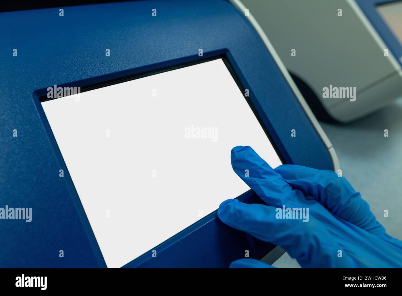 Doctor reviewing patient data on touchscreen monitor Stock Photo - Alamy