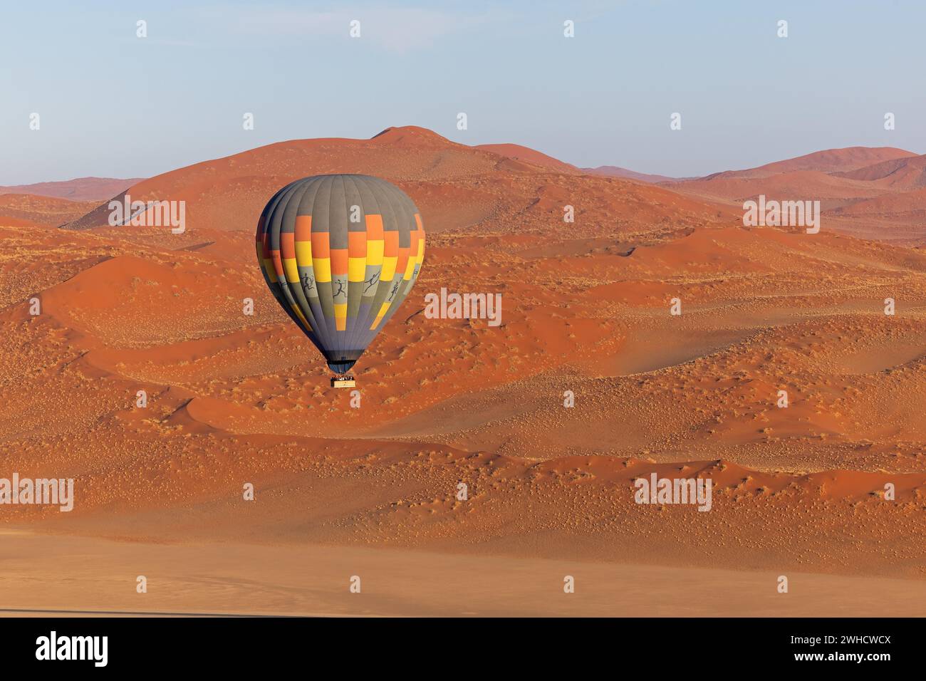 Red sand dunes in the Namib-Naukluft National Park, hot air balloon ...